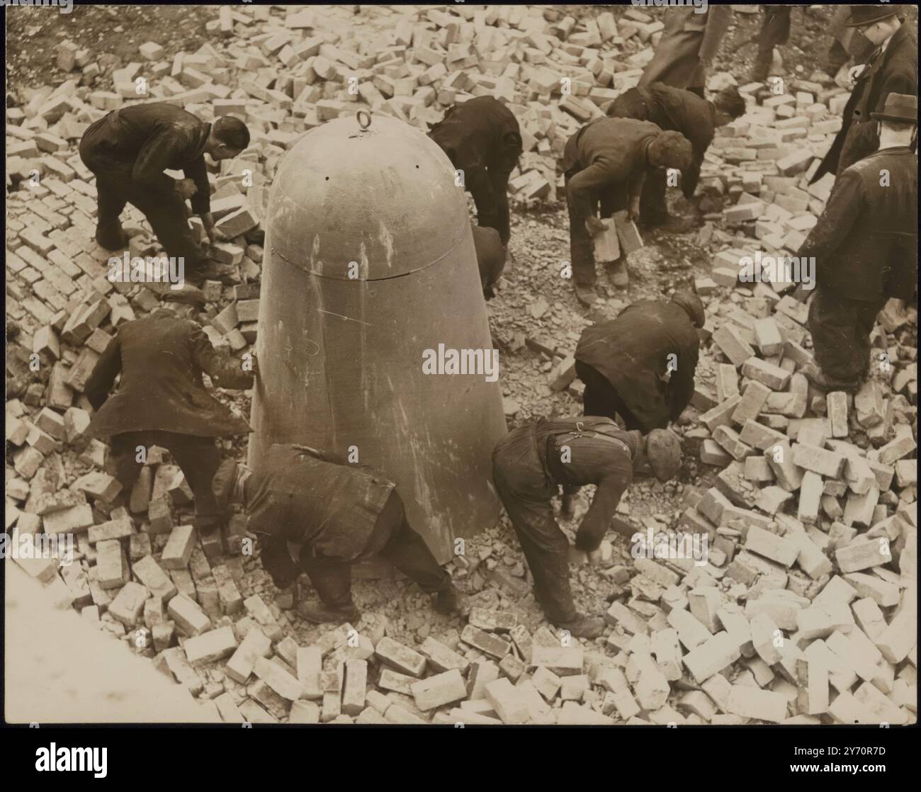 FACTORY WAILS COLLAPSED ON TO AIR RAID SHELTERS AS TEST.Tons of masonry ...