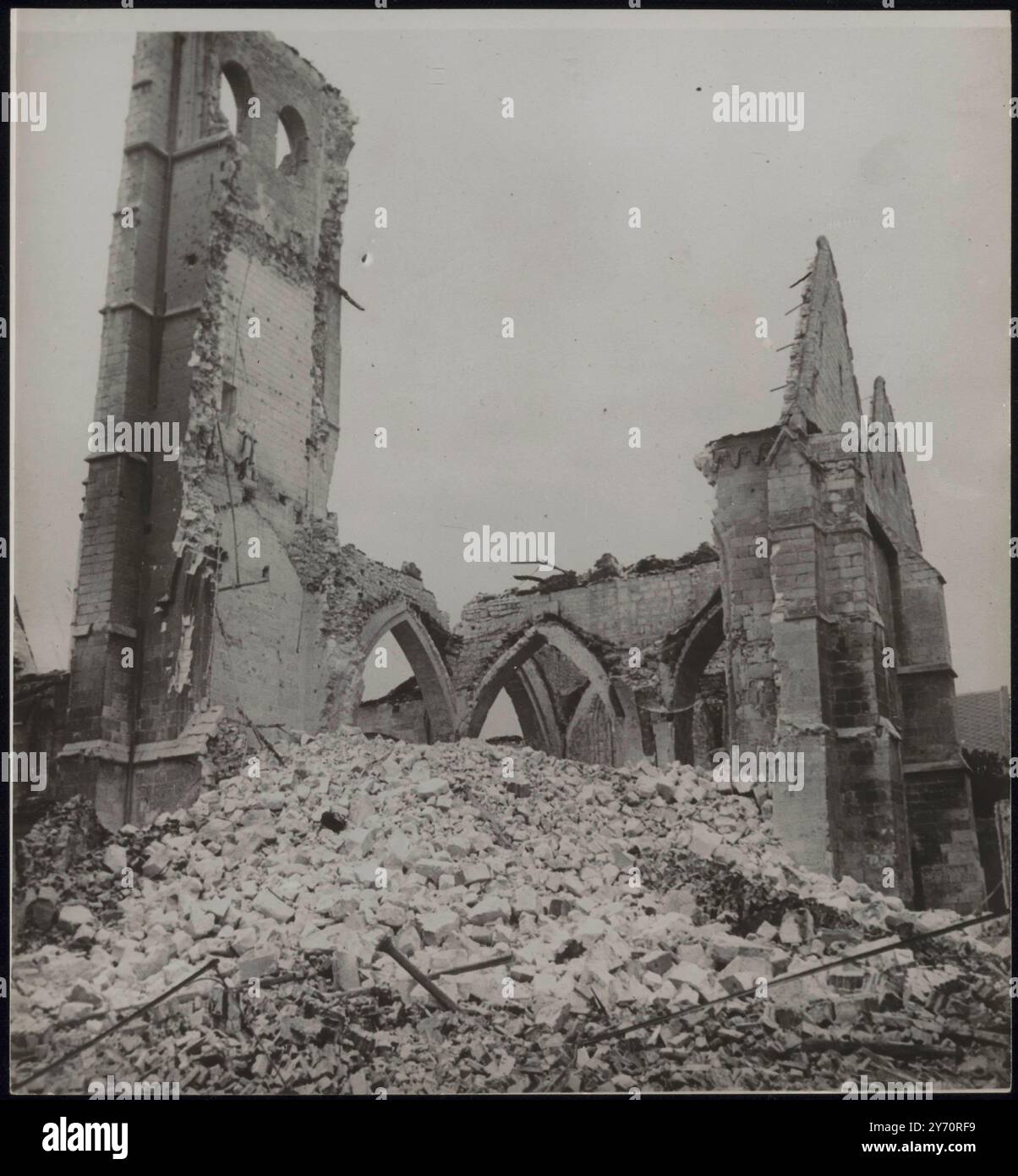 THE REMAINS OF A CHURCH.PHOTO SHOWS:- A great pile of rubble amid the ...