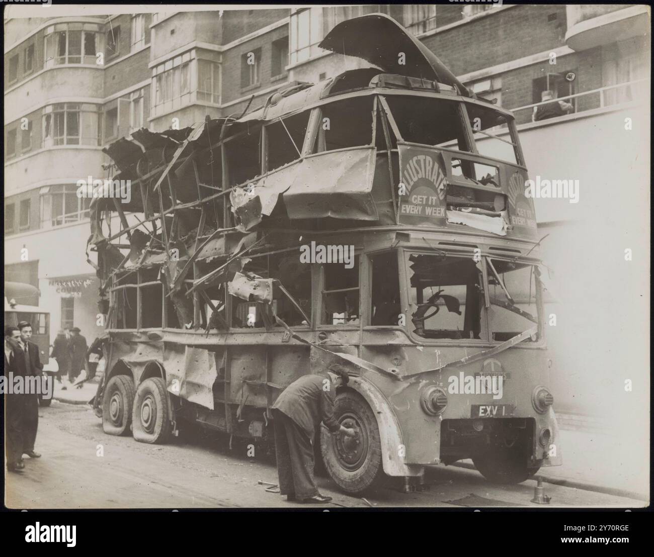 TROLLEY-BUS WRECKED BY BOMB.PHOTO SHOWS:- A trolley-bus which was ...