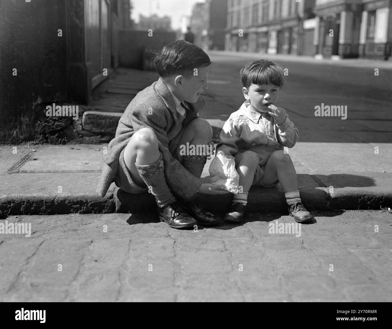 Child and bag of sweets Black and White Stock Photos & Images - Alamy