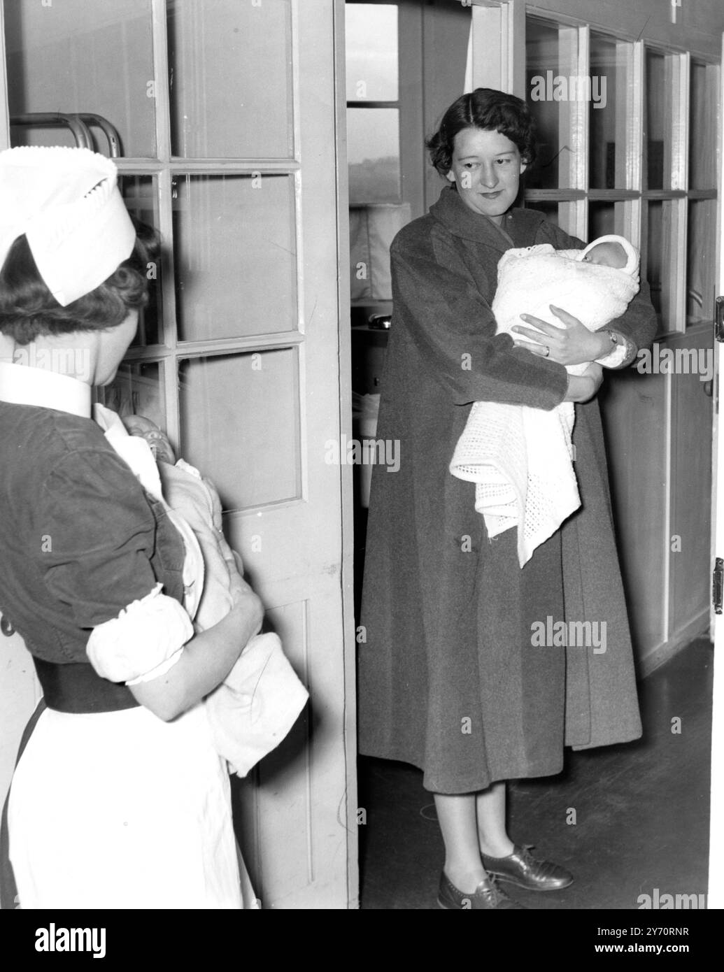Mrs Joyce Parker leaving hospital with her baby 1957 Stock Photo - Alamy