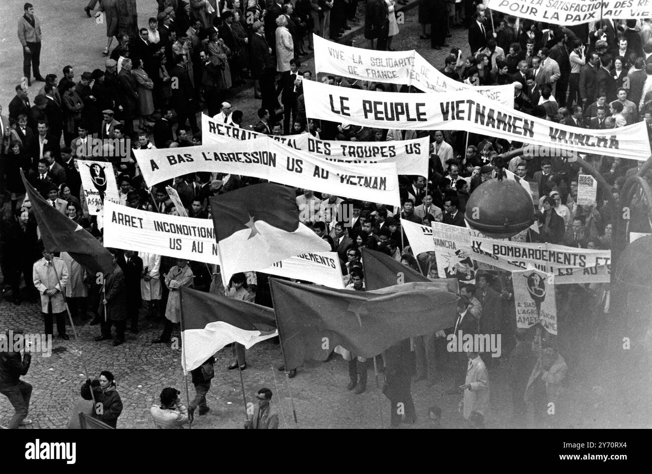 North Vietnamese demonstrators march against American bombings and the ...
