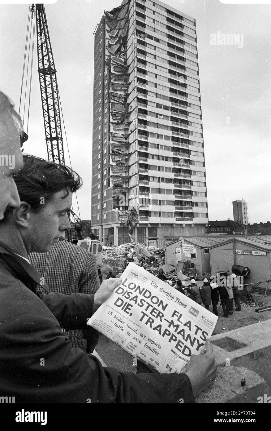 A worker reads the latest headline news on this morning's partial ...