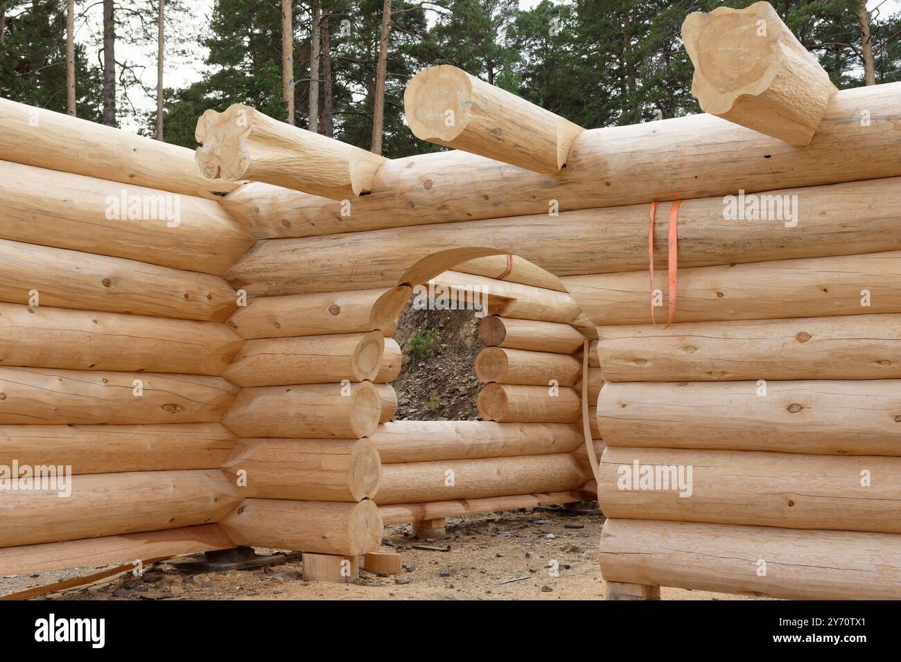 The construction site of a wooden house. Traditional log cabin built ...
