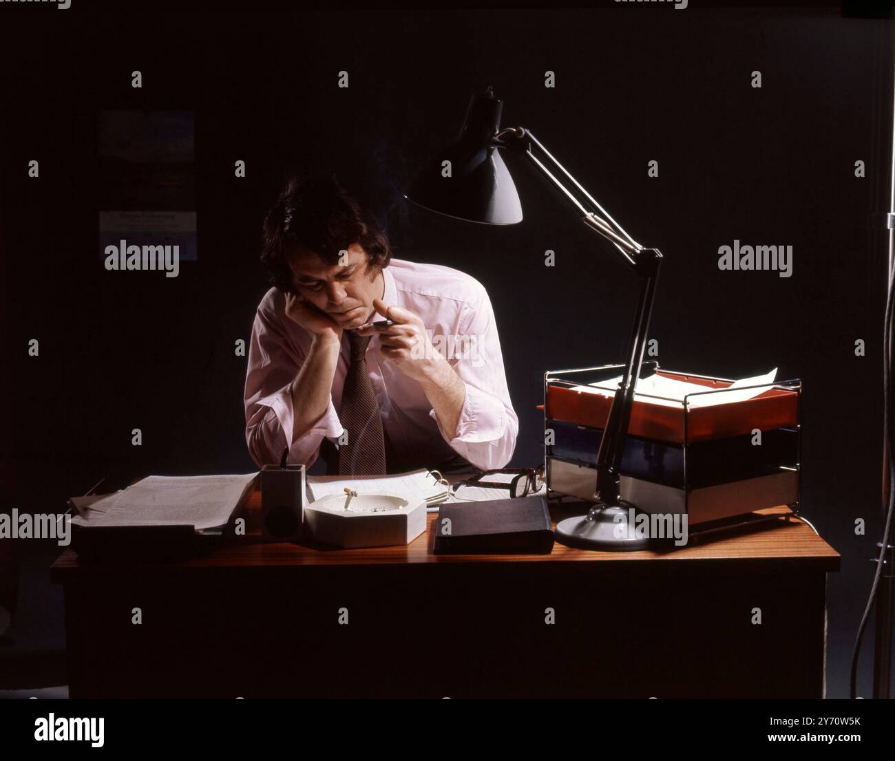 Man working late in the office 1970's Stock Photo - Alamy