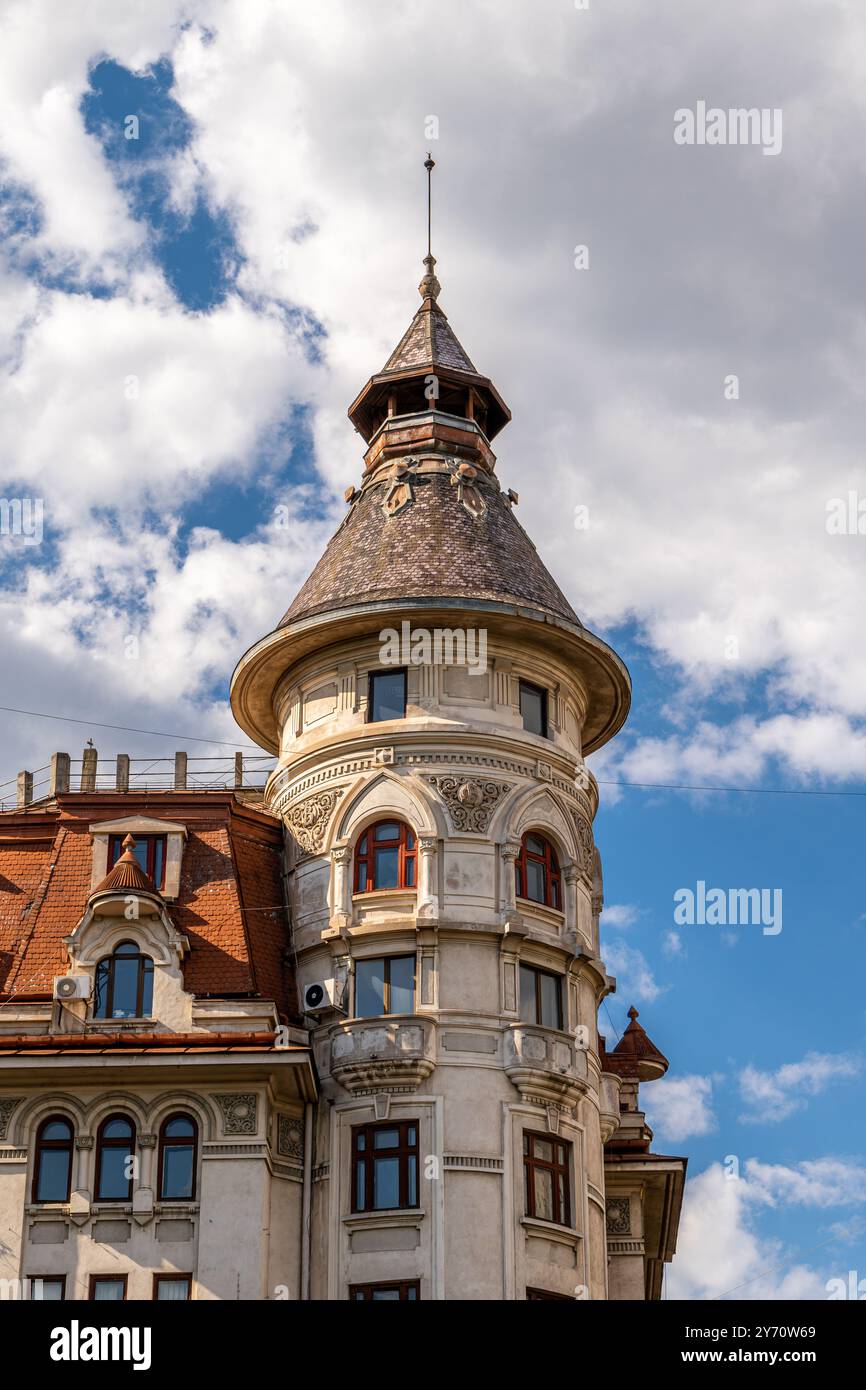 A typical corner building with a nice spire in the city center of ...