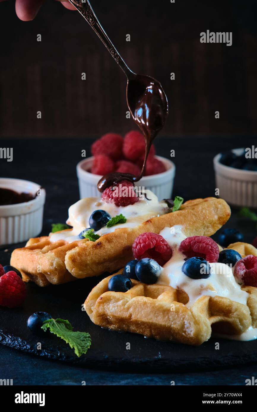 still life Belgian waffles on dark background Stock Photo - Alamy