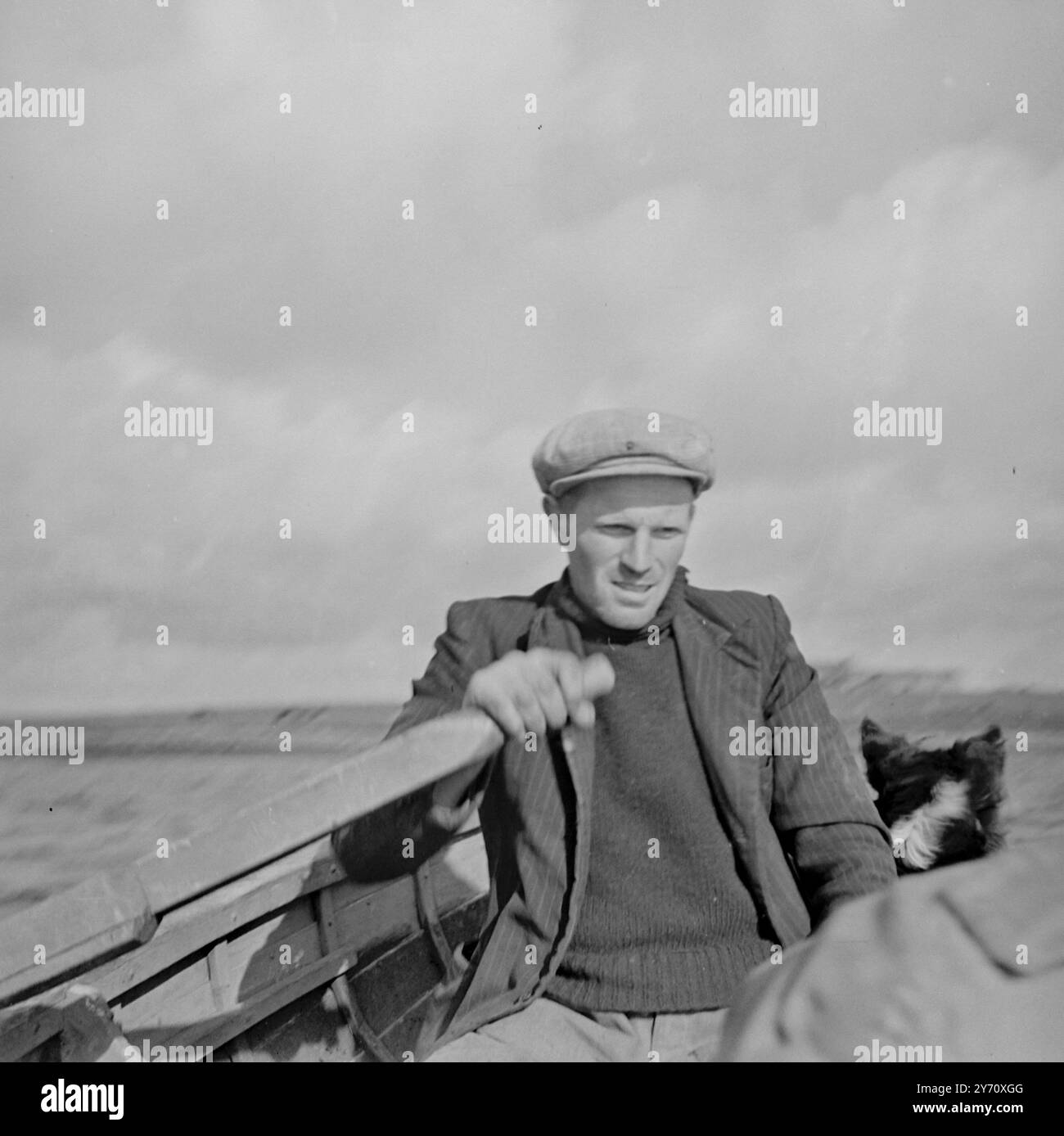 ORKNEY - Mr Leslie rowing boat . 1 January 1946 During harvest time ...