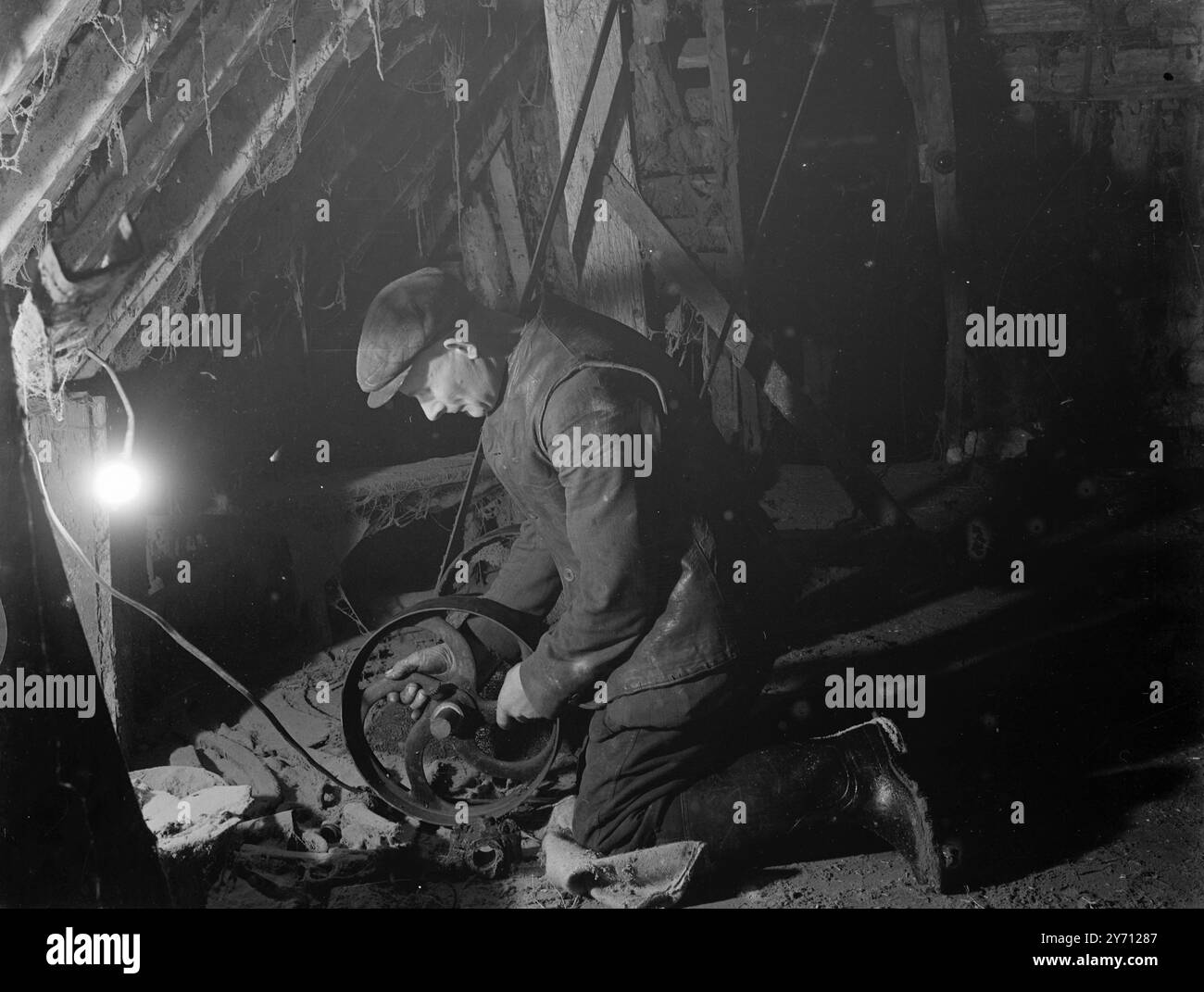 Repairing Hay loft pulley . 1 January 1947 Stock Photo - Alamy