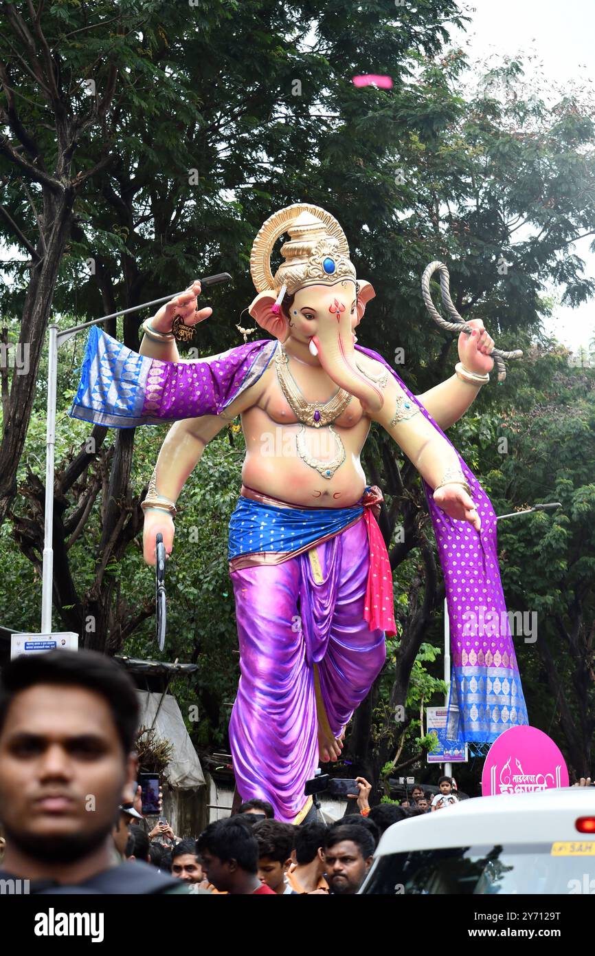 Ganesha Chaturthi festival in Mumbai, India Devotees bring an idol of ...