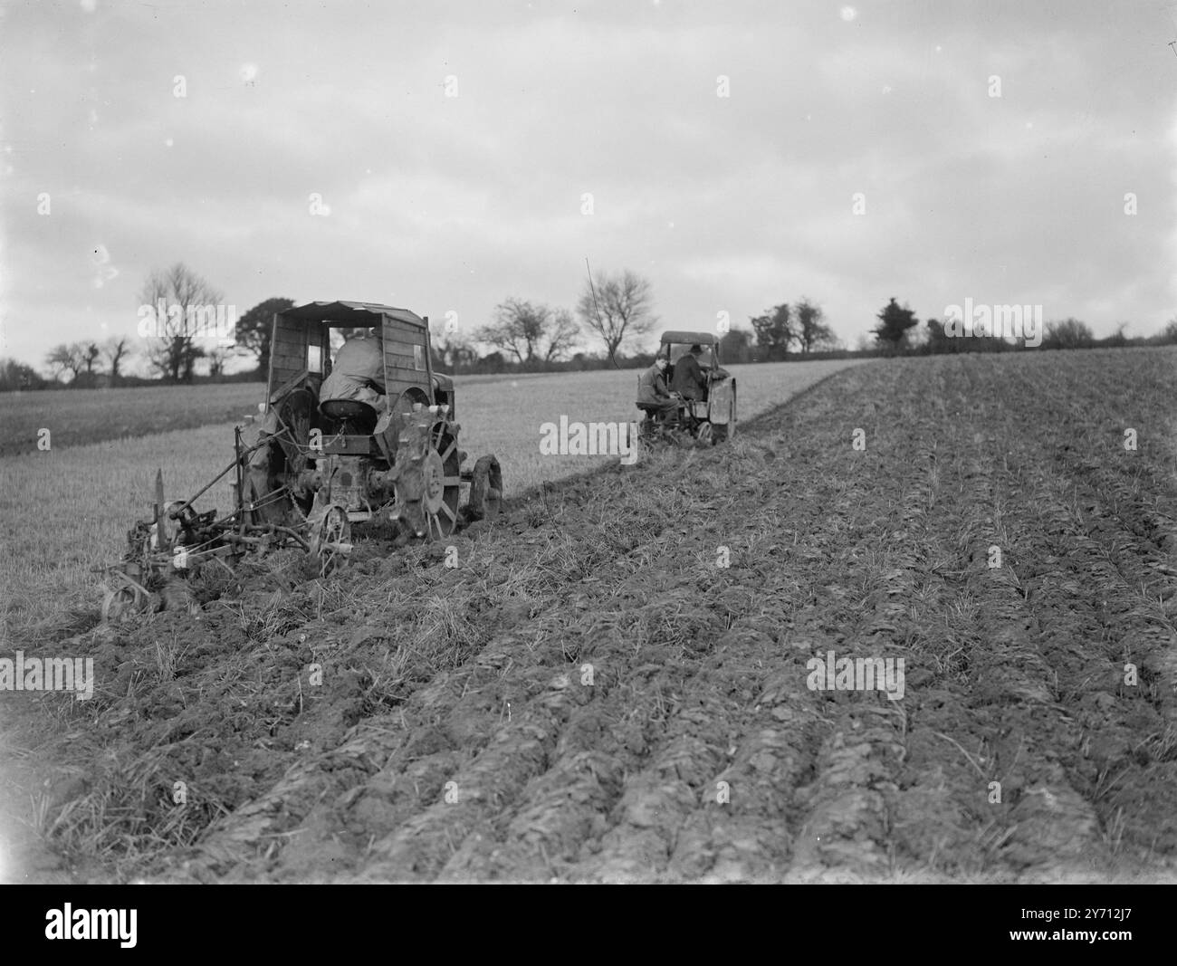 Two tractors Black and White Stock Photos & Images - Alamy