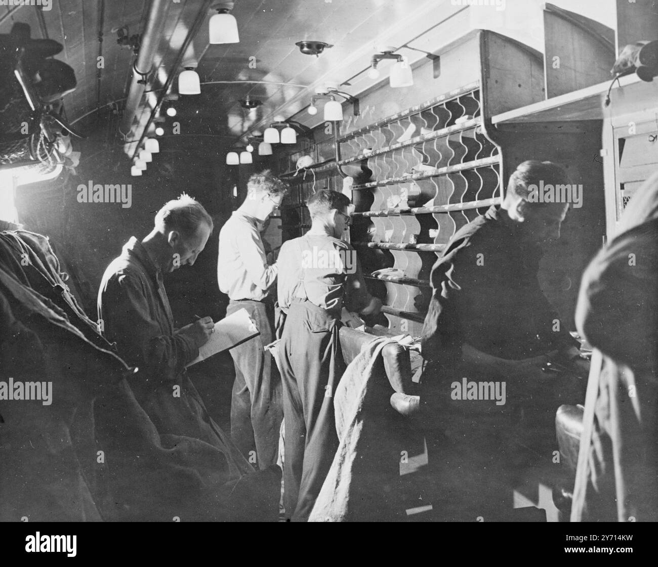 POSTAL SPECIAL -Sorting letters . Euston station . 1 January 1946 Stock ...