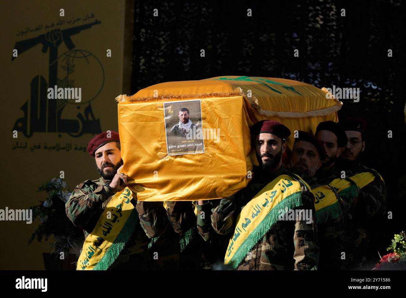 Hezbollah members carry the coffin of Hezbollah commander Khodor ...