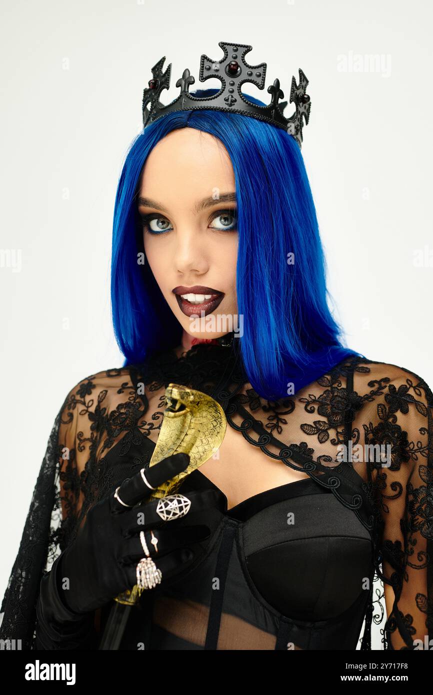 The woman wears an elaborate Halloween costume with a dramatic crown ...