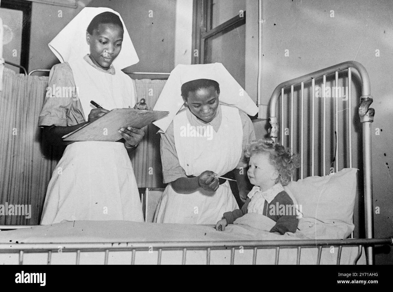 African nurse helping patient Black and White Stock Photos & Images - Alamy