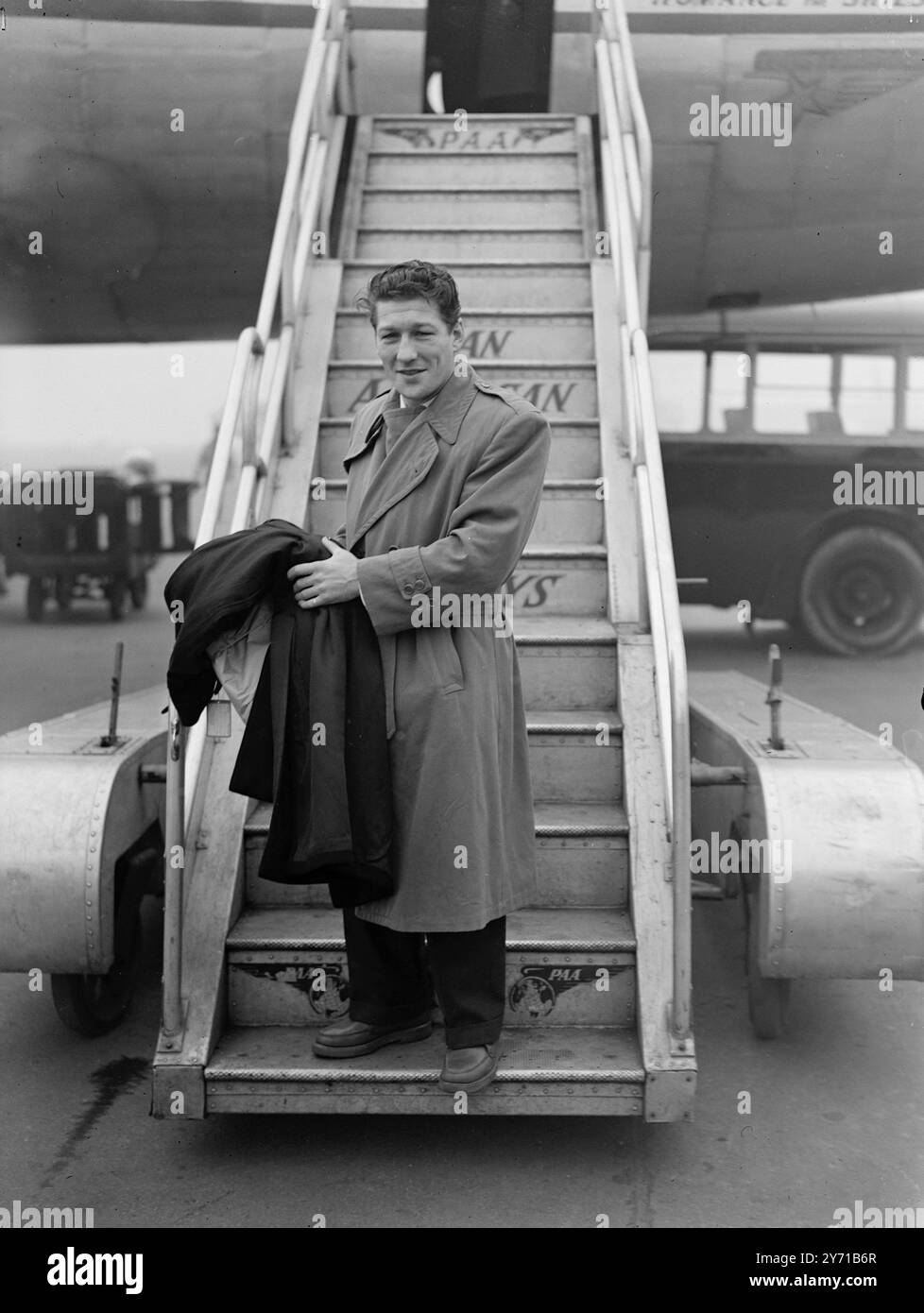 A FIGHTER RETURNS Boxer , ERIC BOON , pictured on his arrival at London ...