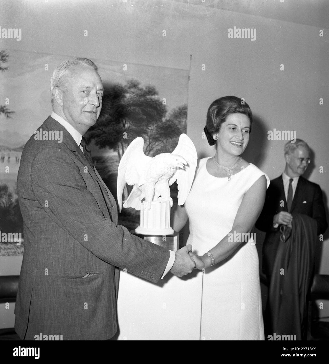 Mrs Edward Marshal Boehm , the wife of a US sculptor-ceramist , hands ...