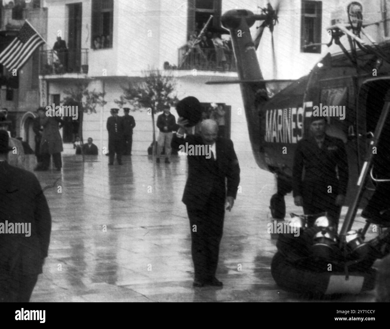 President Dwight D Eisenhower tips his hat before boarding a helicopter ...