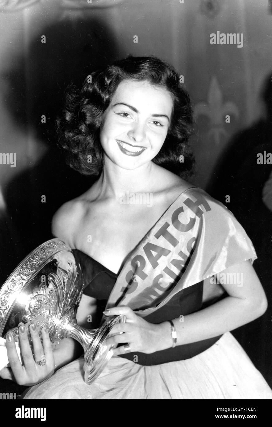 18 year old student Miss Denise Perrier from France clutches the cup ...