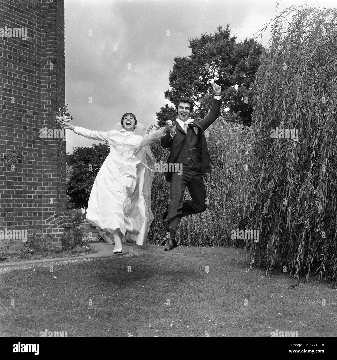 Jumping for joy after their marriage at St James Church , New Malden ...