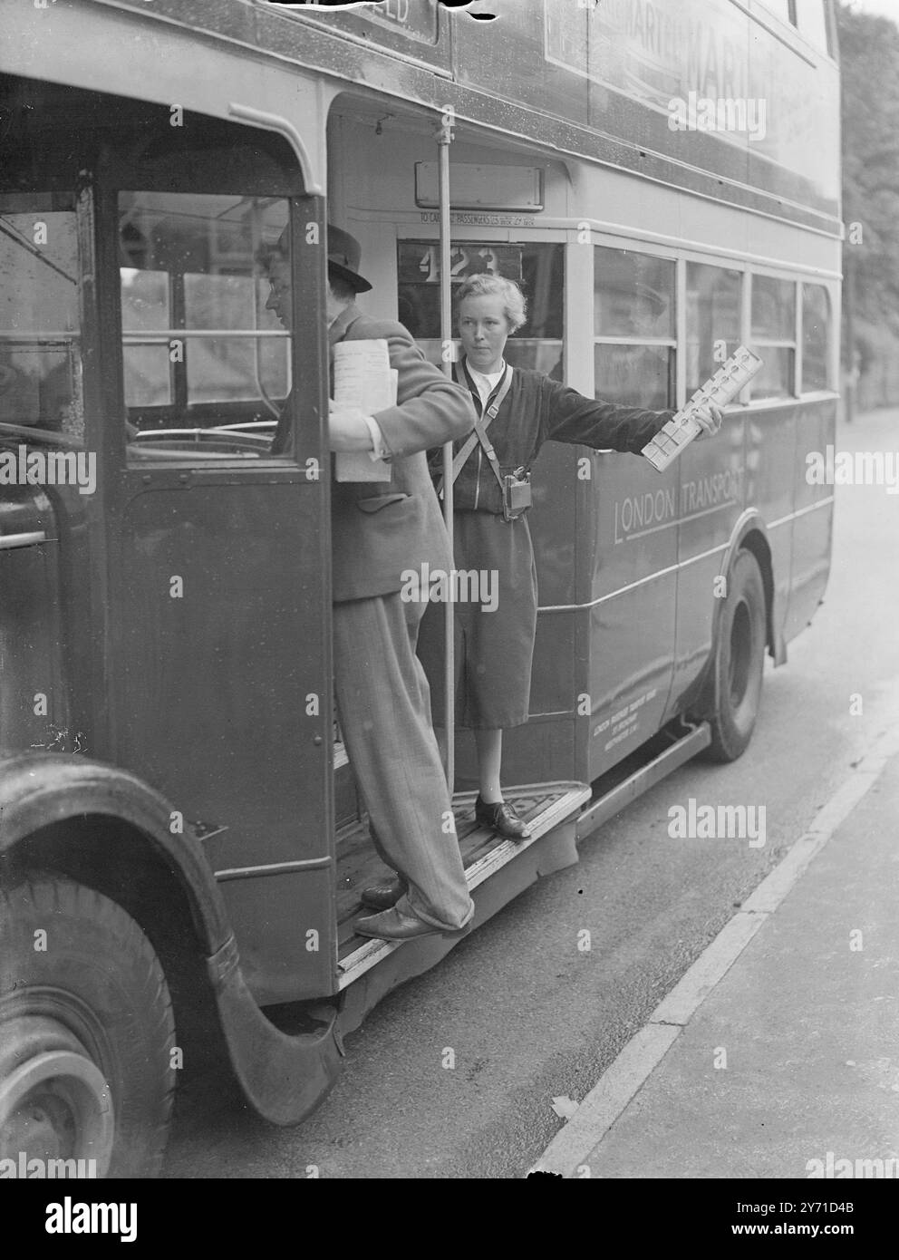 Woman bus conductor ( war time )1940 Stock Photo - Alamy