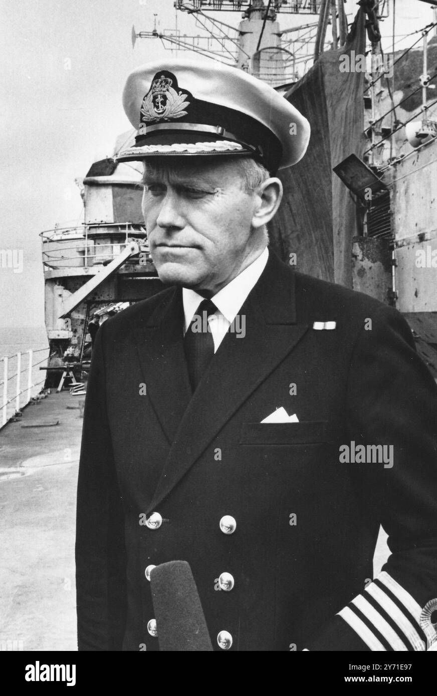 CAPT. MICHAEL BURROW , STANDS IN FRONT OF THE DAMAGED SUPERSTRUCTURE OF ...