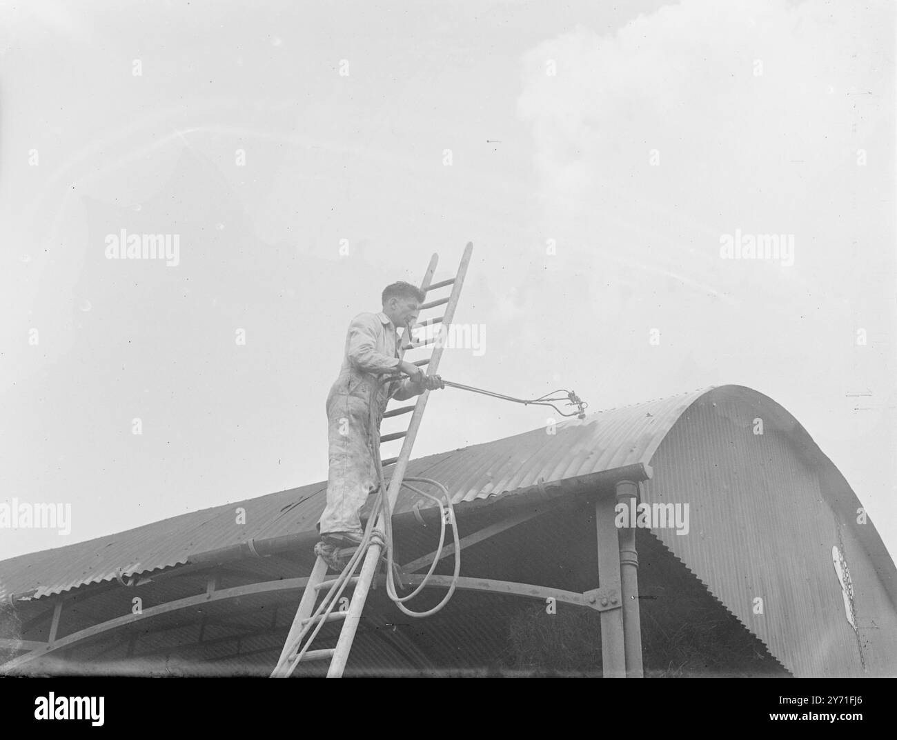 Mobile Paint spraying for farm buildings . c. 1940 Stock Photo - Alamy