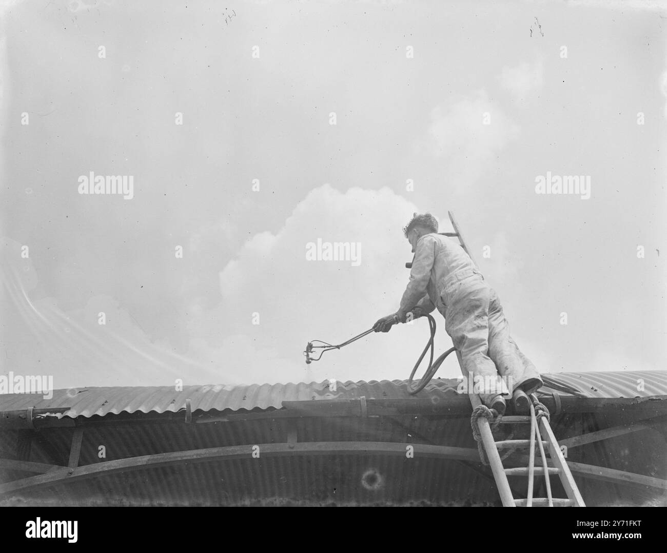 Mobile Paint spraying for farm buildings . c. 1940 Stock Photo - Alamy