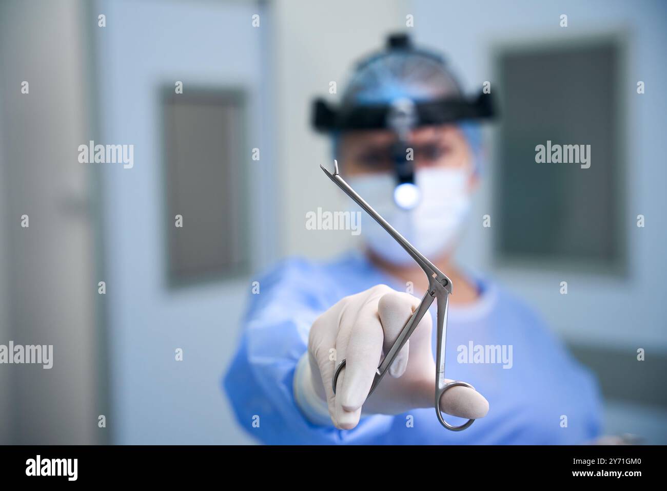 Woman holds special instrument made of medical steel in her hand Stock ...