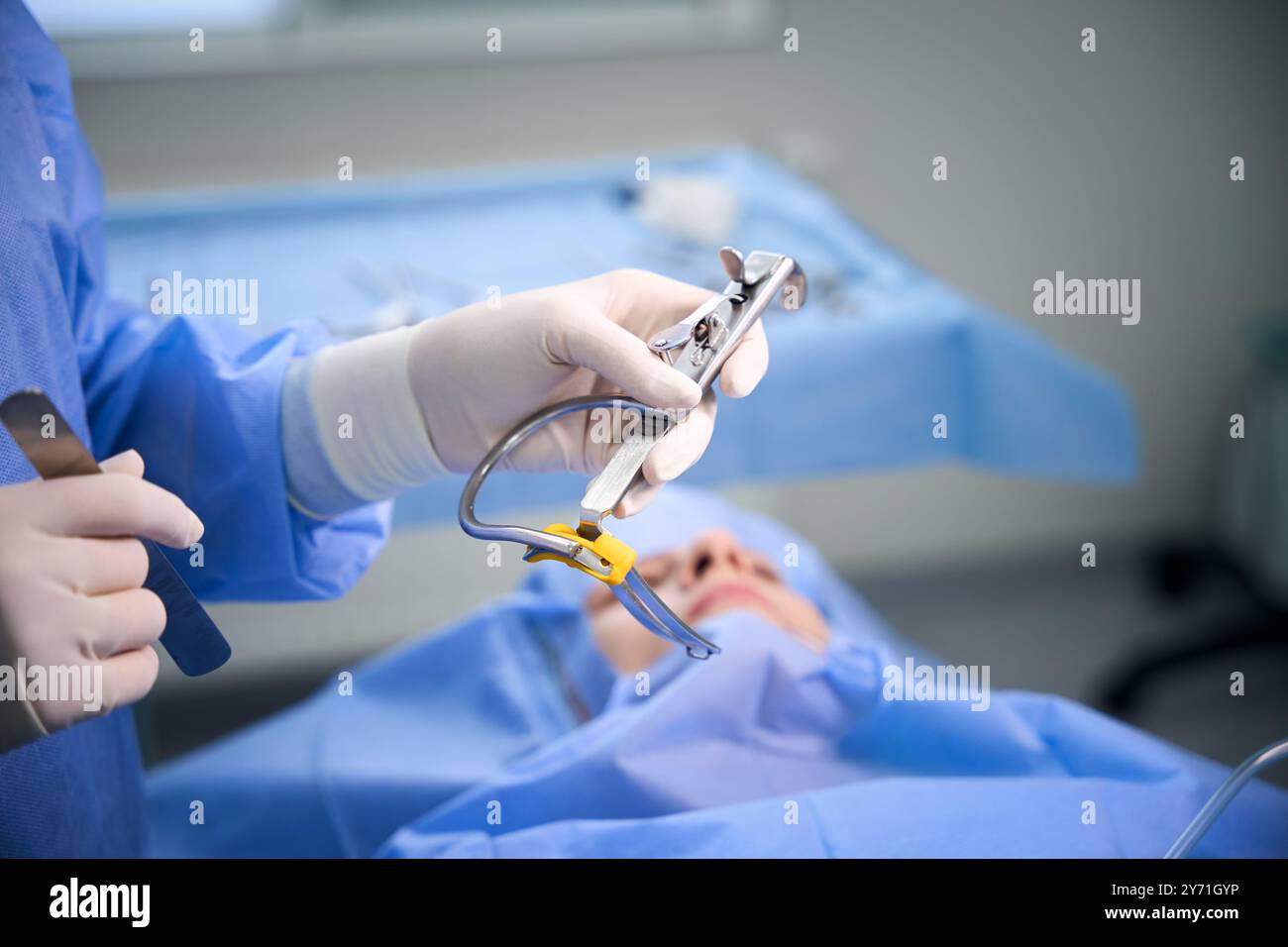 Surgeon uses a special instrument in his work Stock Photo - Alamy