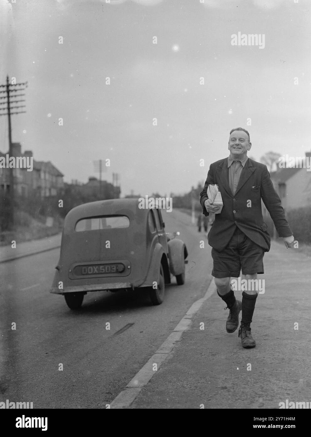 Man walking in shorts Black and White Stock Photos & Images - Alamy