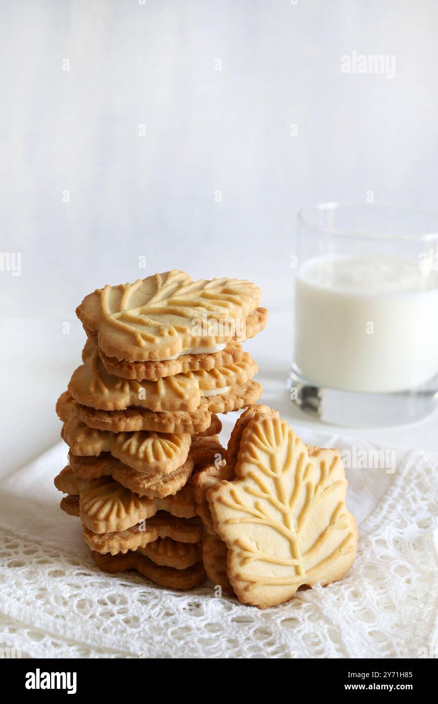 Classic Canadian maple leaf shaped cookies and a milk glasse. Maple ...