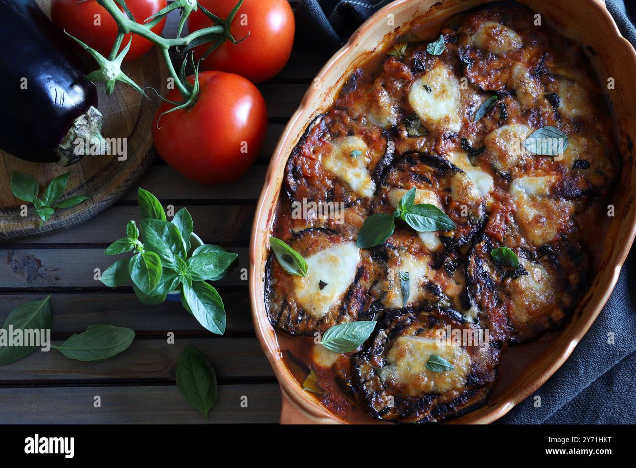 Baked aubergine parmigiana. Dish based on aubergines, tomato puree ...