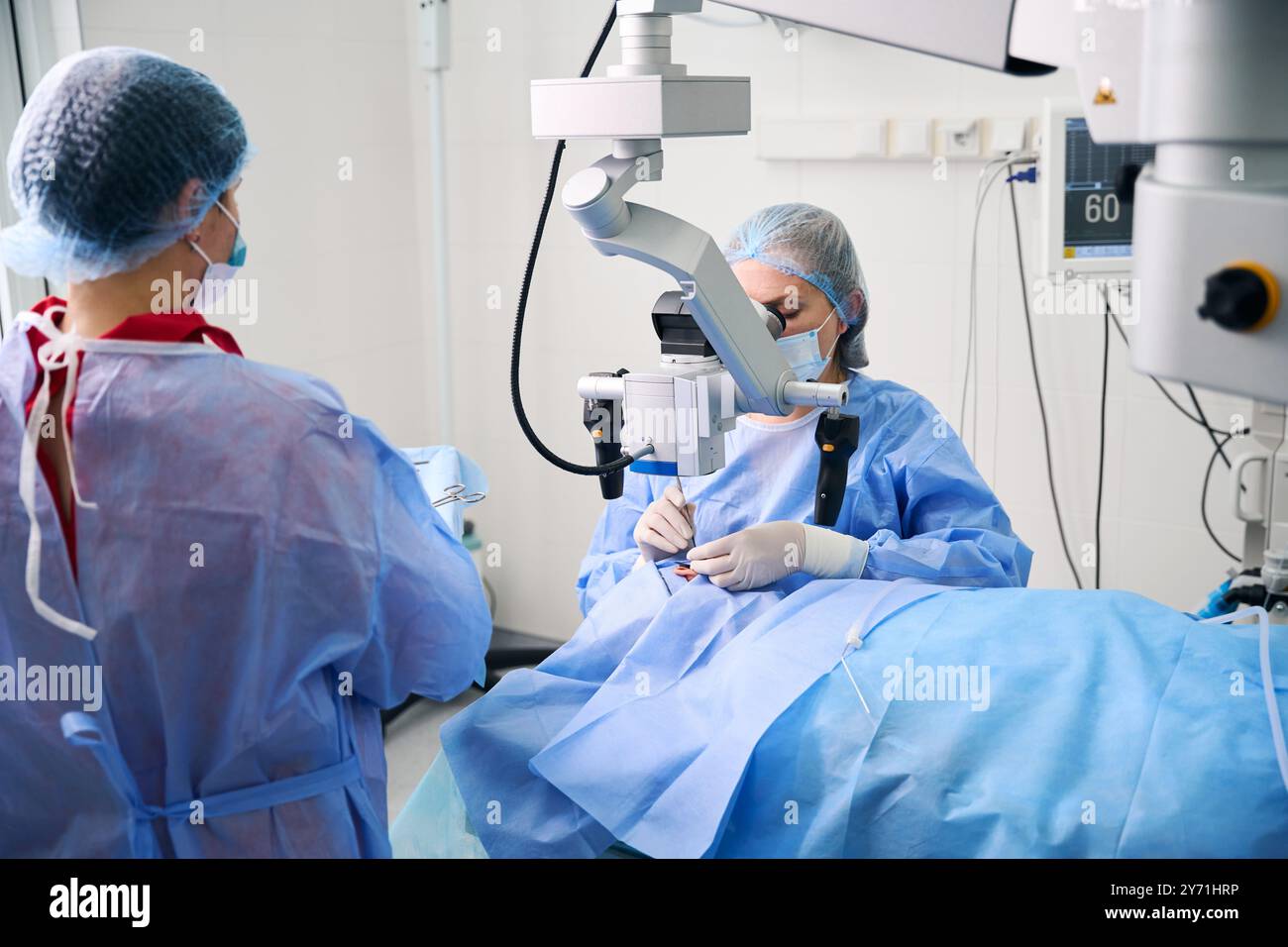 Female surgeon performs a surgical operation using a surgical ...
