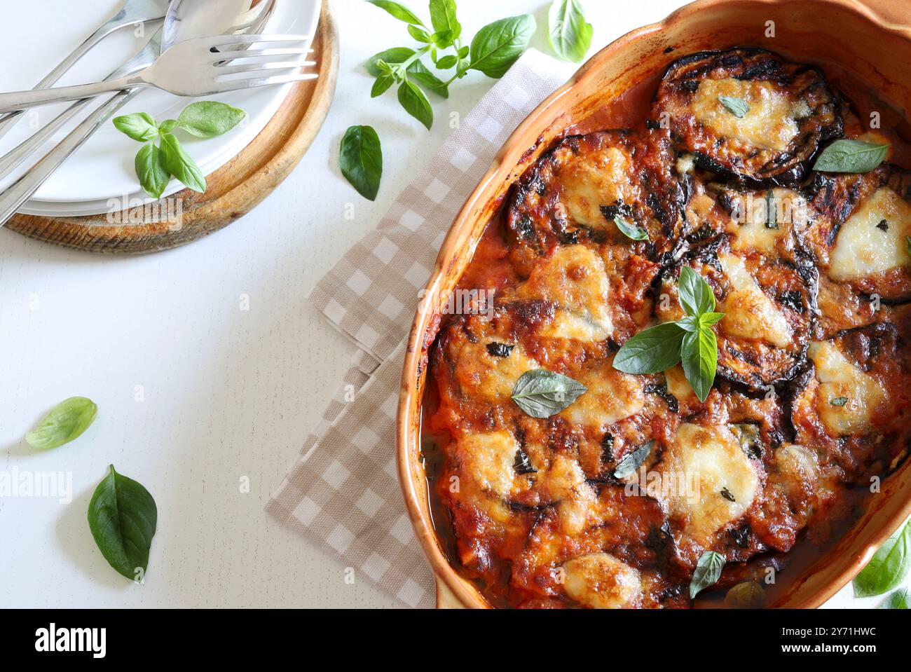 Baked aubergine parmigiana. Dish based on aubergines, tomato puree ...