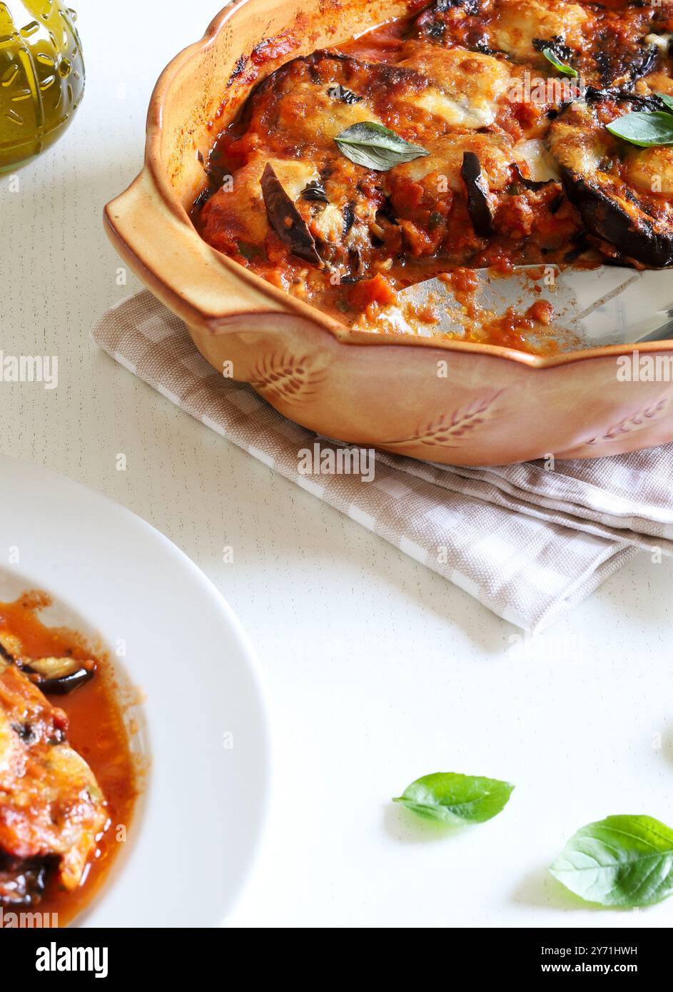 Baked aubergine parmigiana. Dish based on aubergines, tomato puree ...