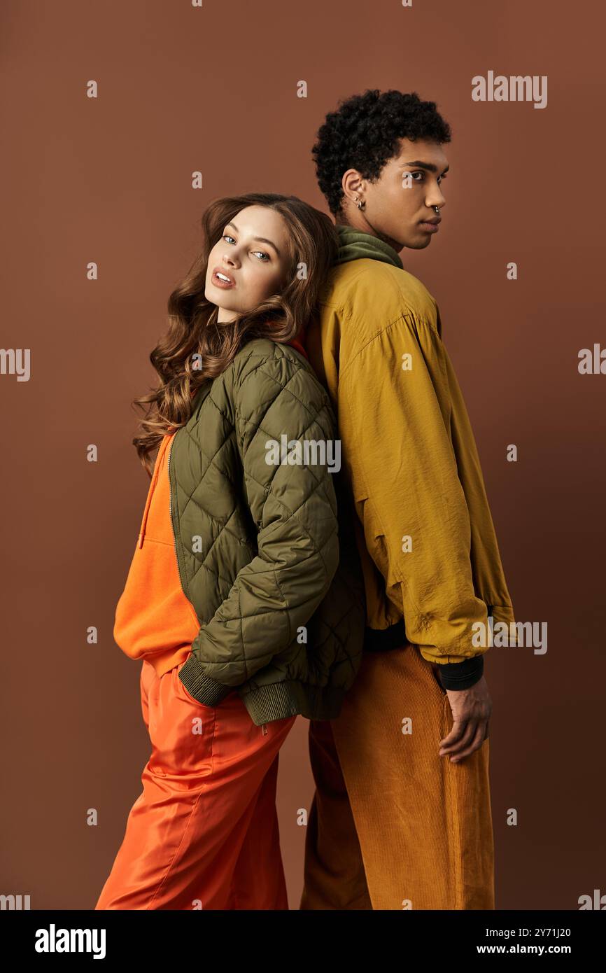 This stylish couple showcases their trendy autumn outfits, blending ...