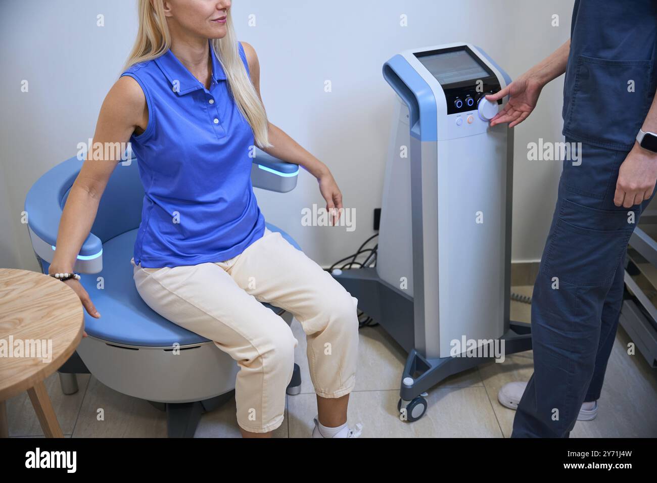 Doctor adjusting special equipment hi-res stock photography and images ...