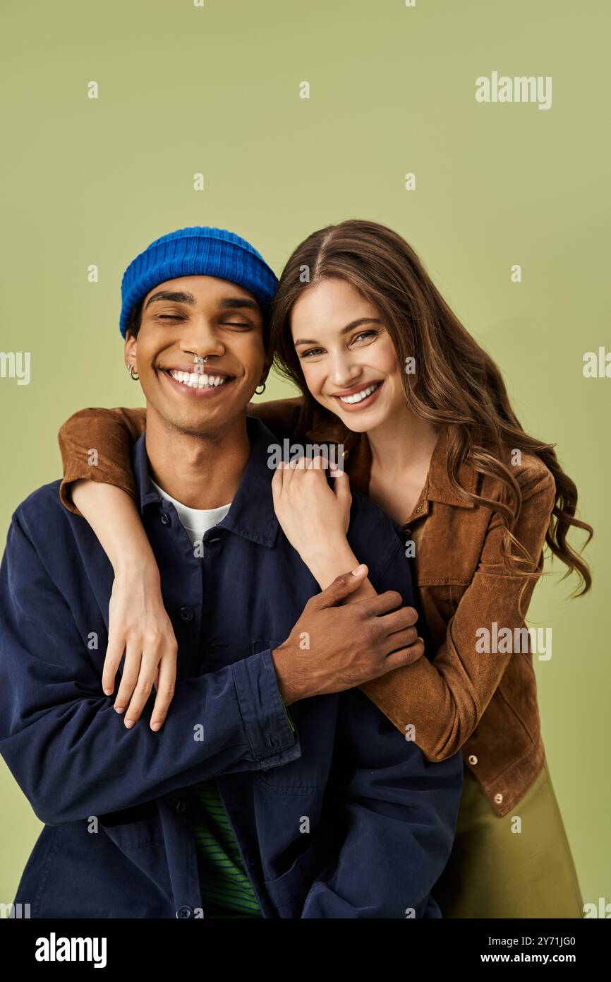 A stylish couple enjoys a joyful moment together, showcasing their ...