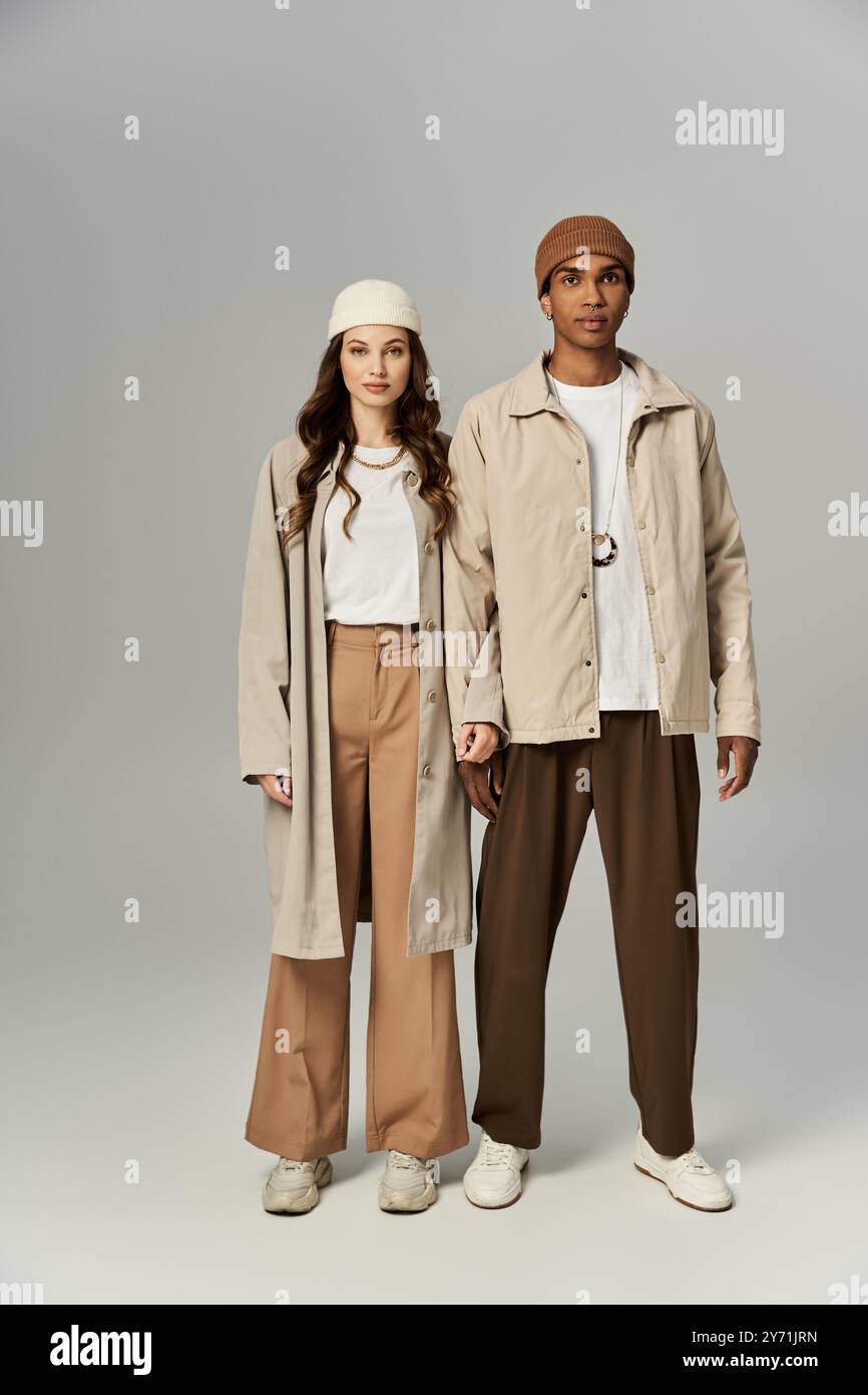 A fashionable couple showcases their vibrant autumn attire while ...