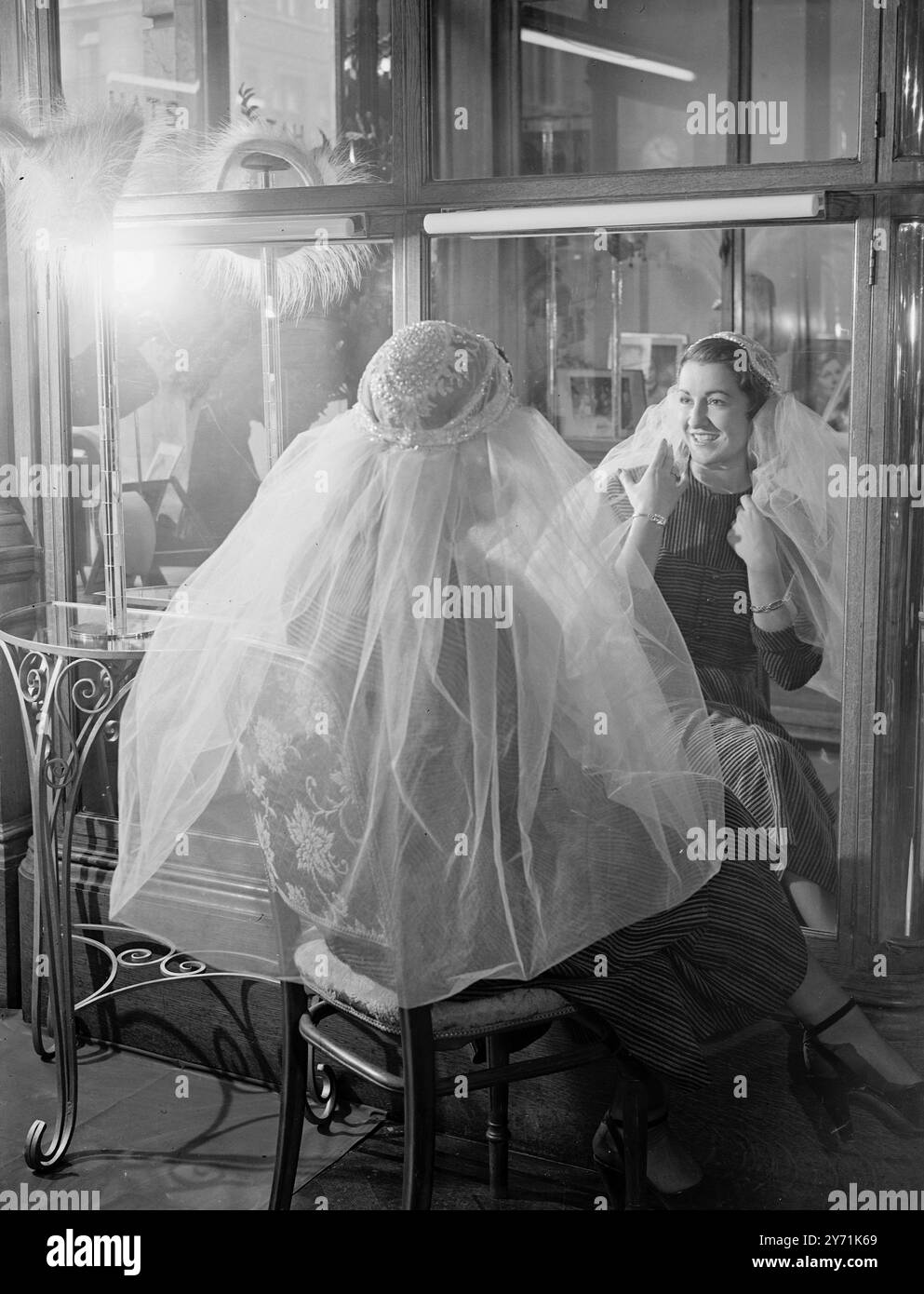 TO-MORROW 'S BRIDE TRIES ON WEDDING CAP OF CRYSTAL DROPS Heiress Miss ...