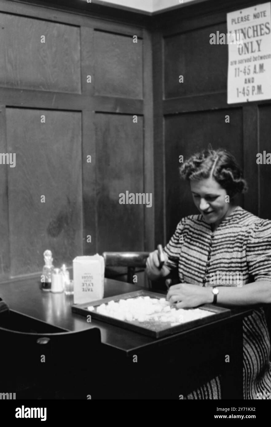 Breaking lumps of sugar - rations, photographed by John Topham 1940 ...