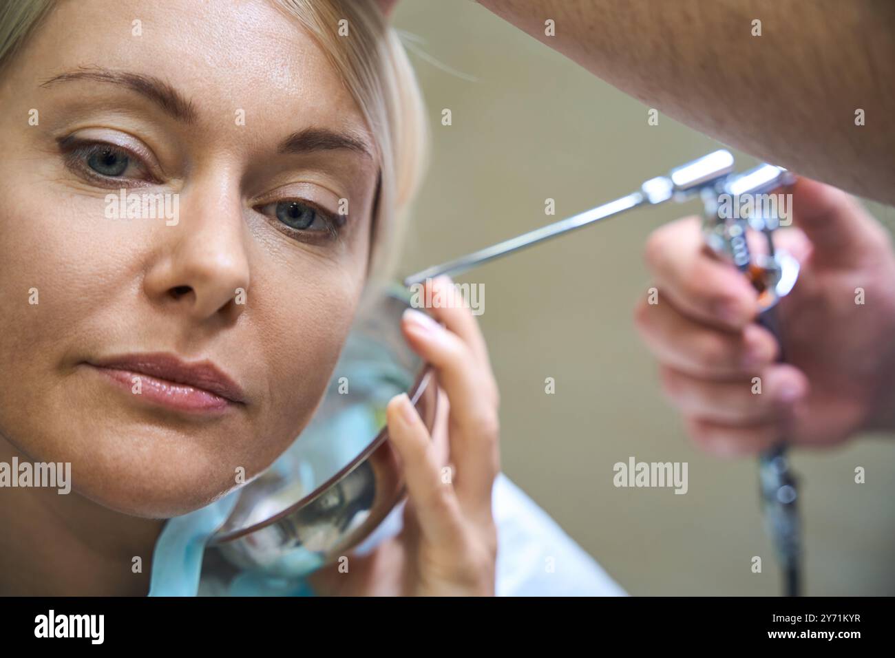 Patient receiving an ear examination from a medical professional Stock ...