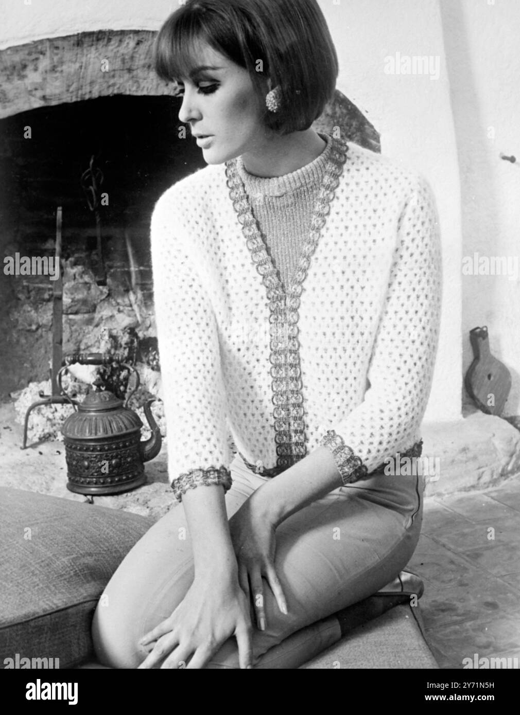 Classic. Florence, Italy : Openwork knitted cardigan in white wool ...
