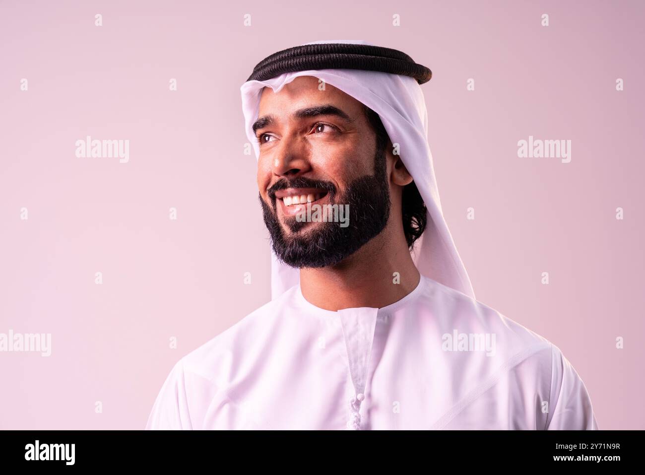 Arab businessman wearing emirati kandura portrait in studio in Dubai ...