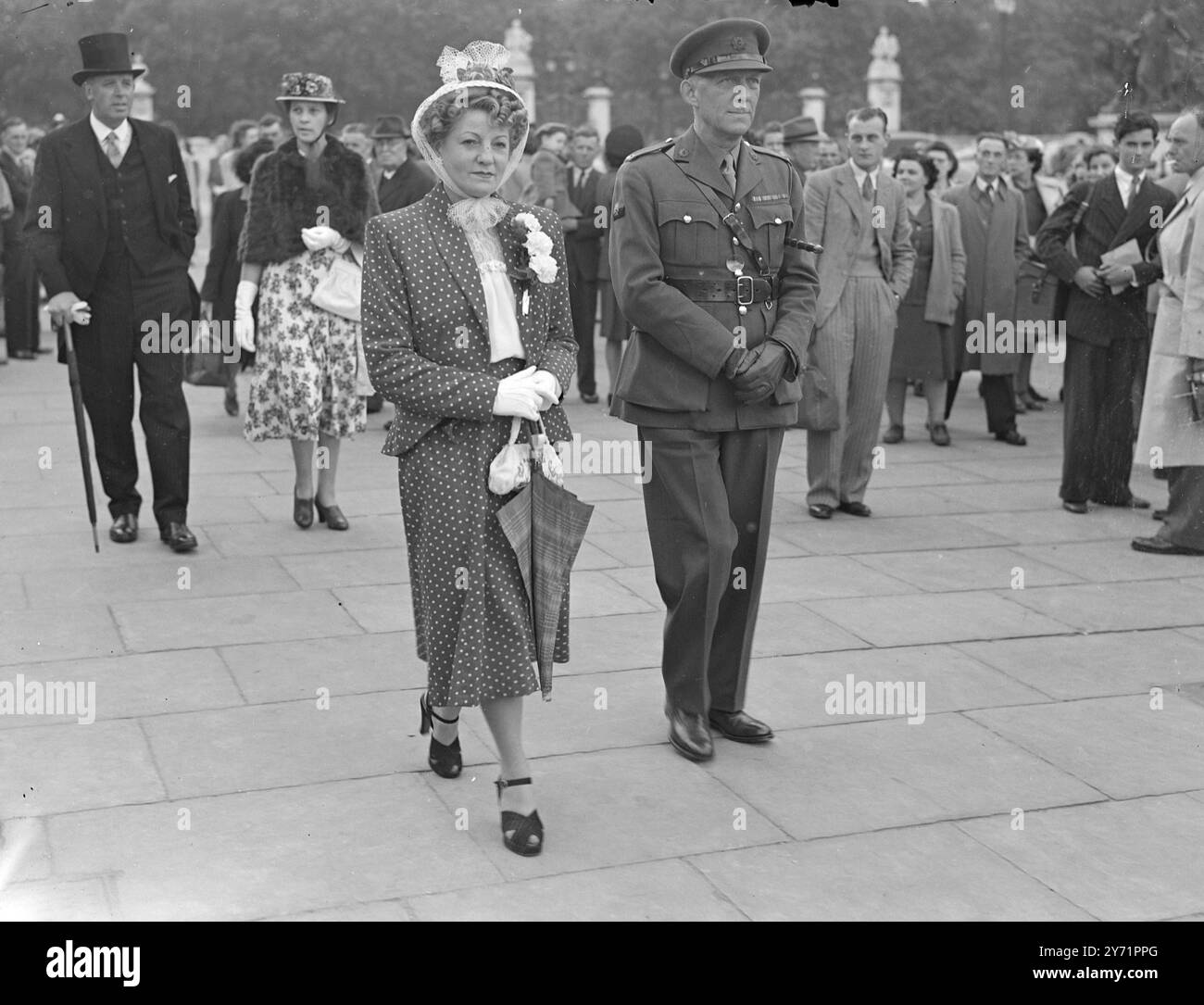 " Palace Fashion " Mrs M Clifford of London , wore this striking red ...