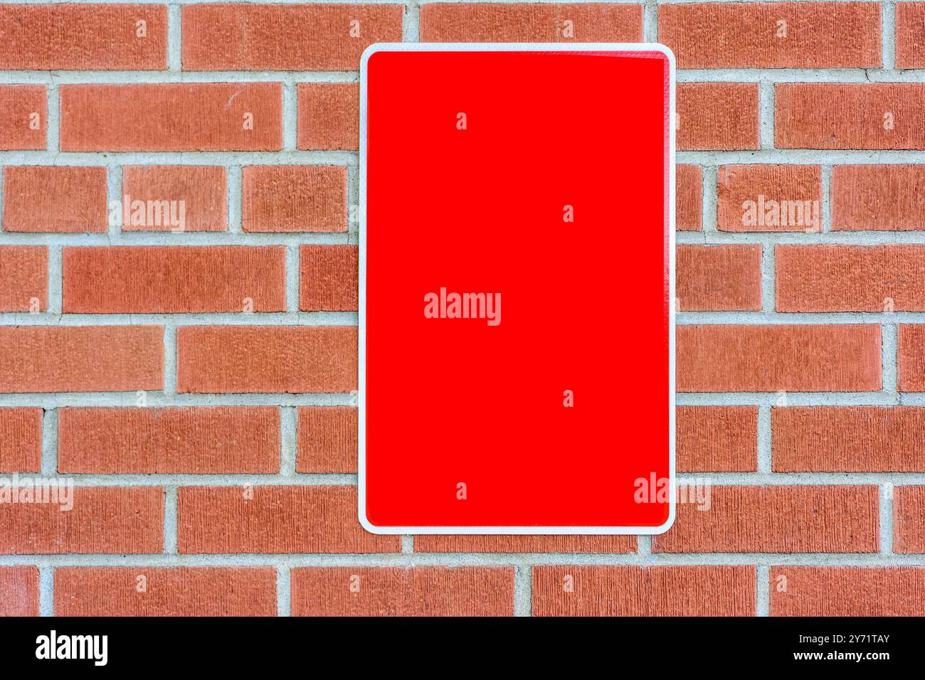Empty red sign on a brick wall Stock Photo - Alamy