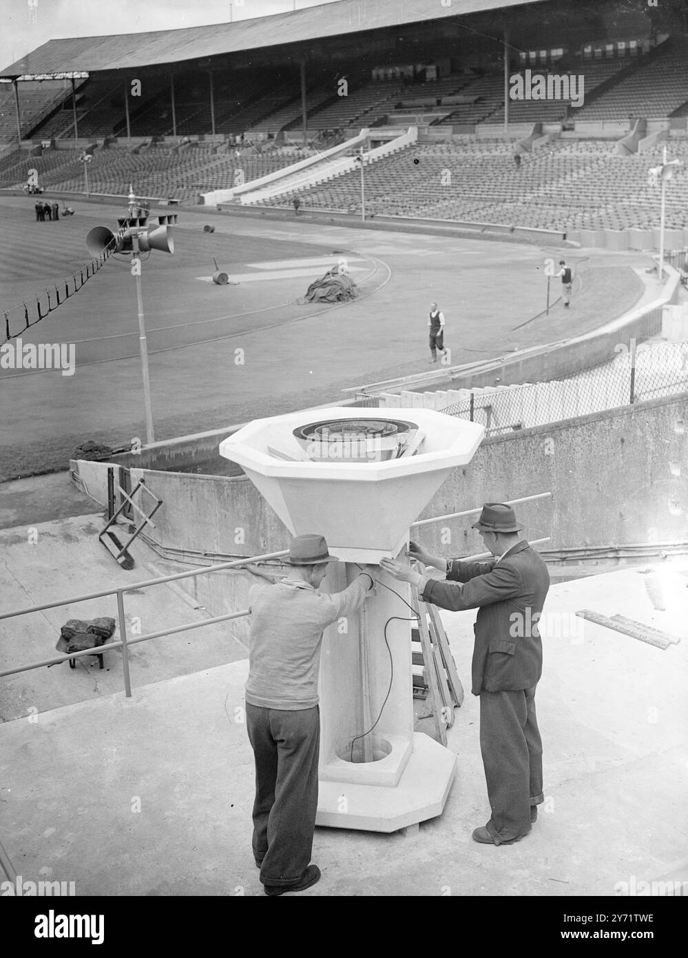 "Torch of Olympia" awaits the flame from Greece. Workmen put the ...
