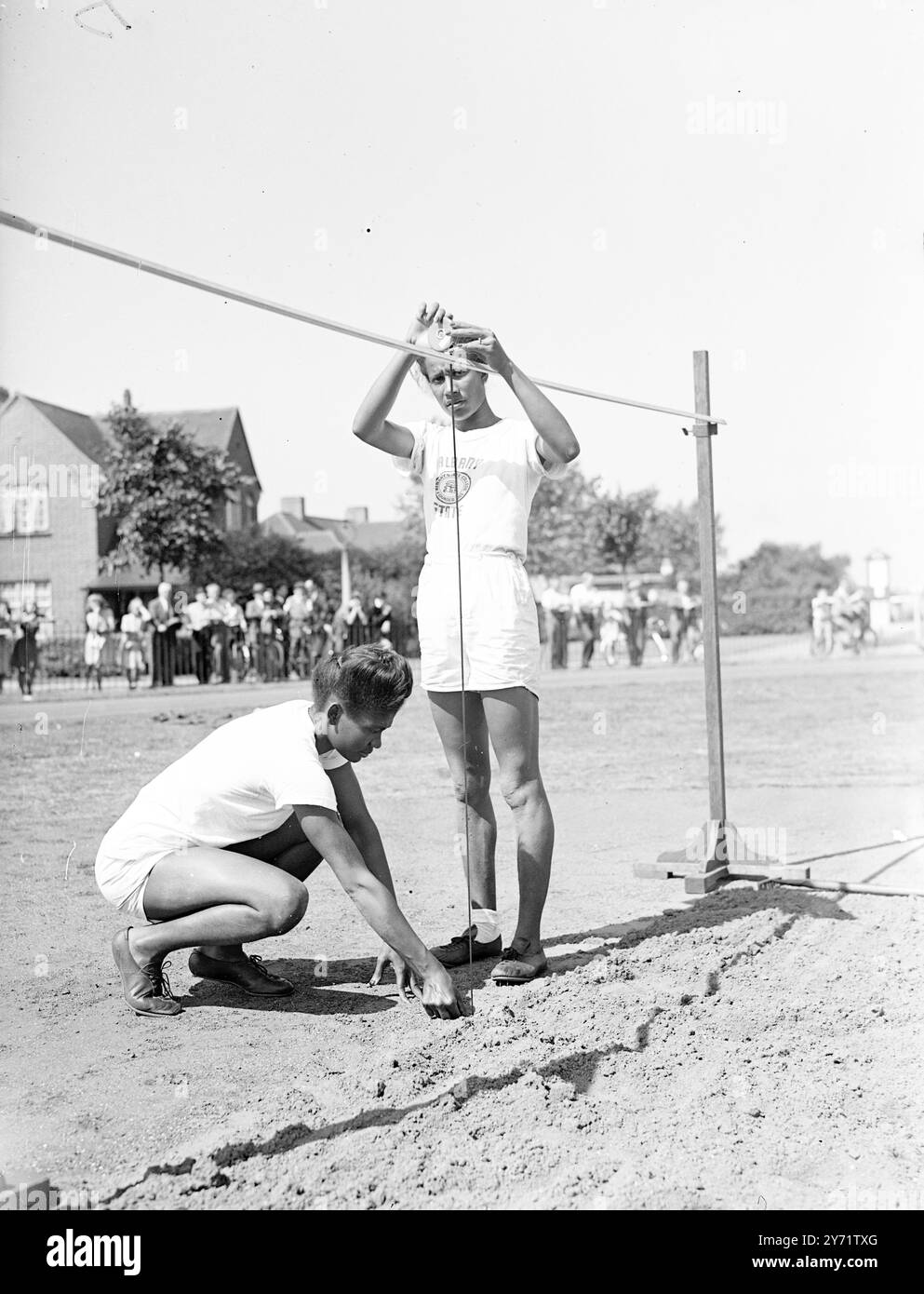 "Measuring up for Olympics" Emma Reed, US high jumper (kneeling) from ...