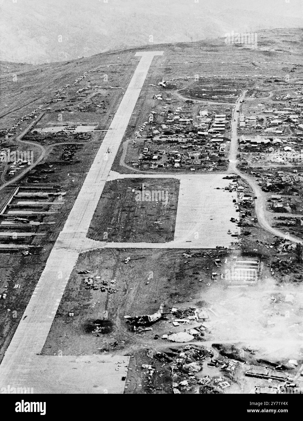 This aerial view shows the airstrip and surrounding areas of the US air ...